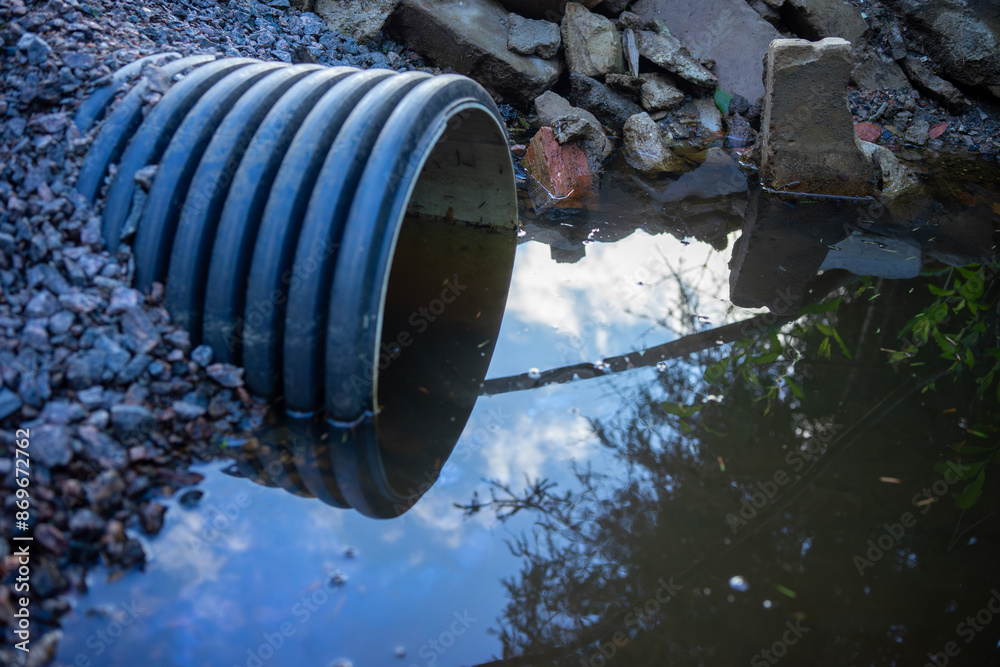 A drainage pipe in the water. Sewage pollution. Discharge of polluted ...