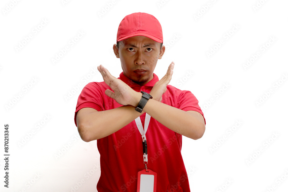 Asian delivery man or courier crosses his arms in a stop or refuse ...