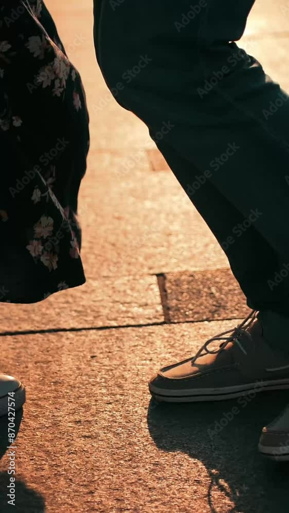 Dancing feet of married couple, dancing at big city street. Some ...