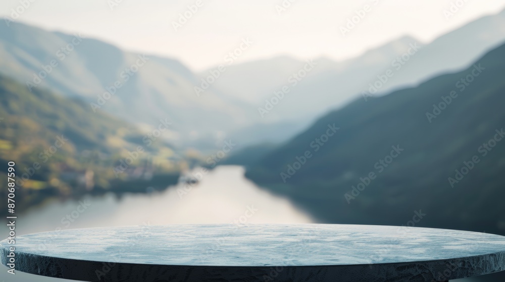 Round stone table with a breathtaking view of a serene lake and ...