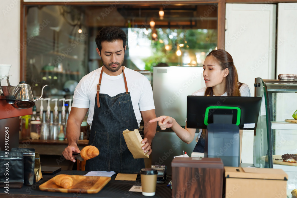 coffee shop owner Multiethnic business men place croissants paper bags ...
