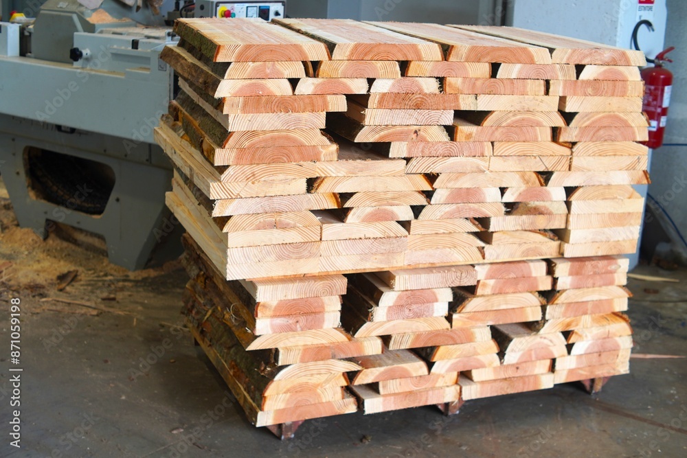 A stack of boards. Wooden planks close up in a lumber yard. Board ...