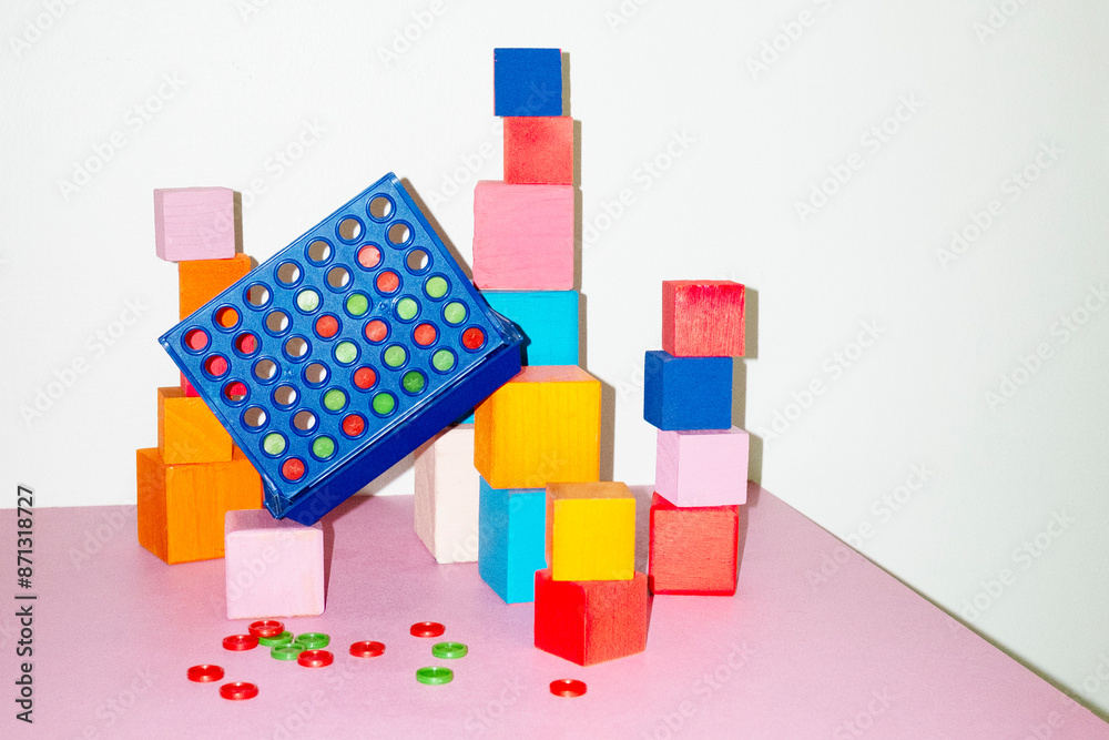 Connect four game and geometry building blocks with hard flashlight ...