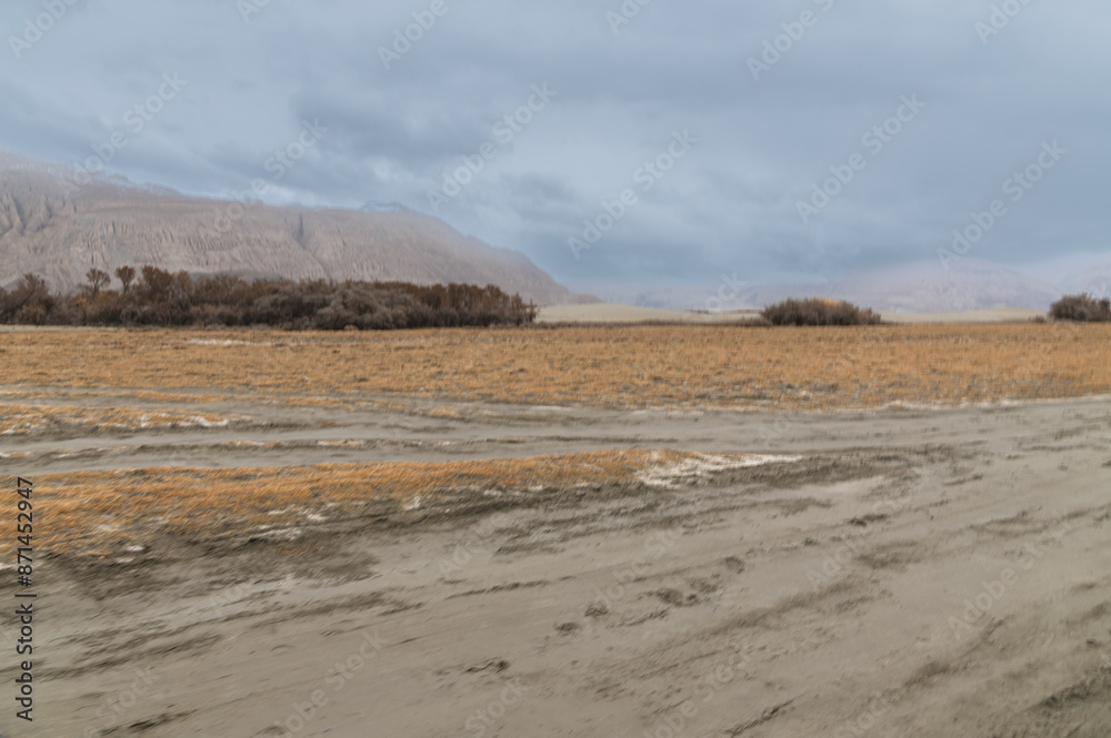 Cold desert landscape from Nubra Valley in Ladakh, India. Sand roads ...