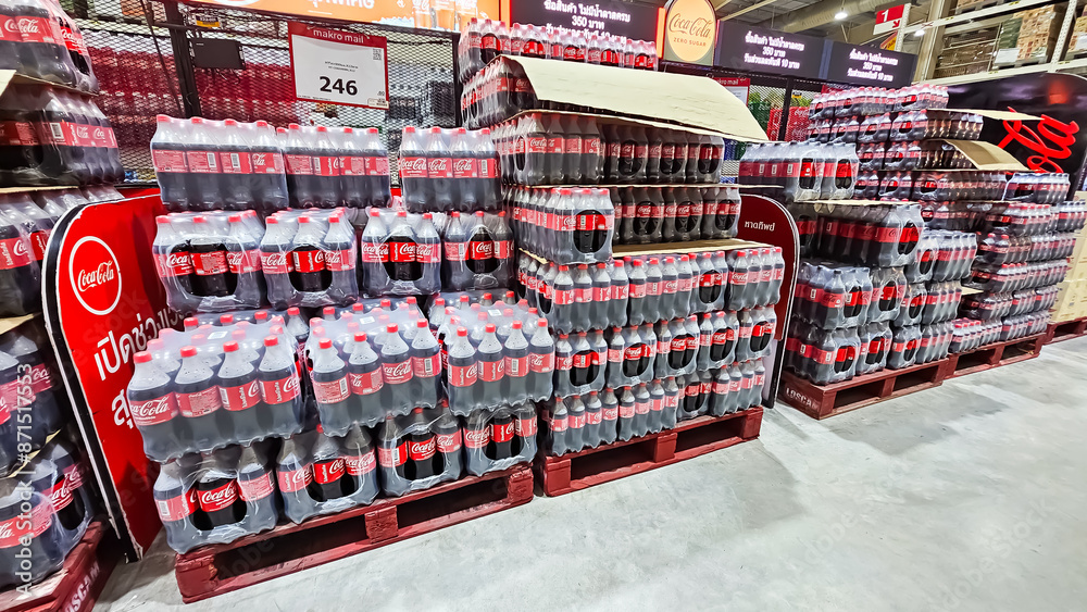 Plastic bottles display of Coke Coca-cola on display piled in multiple ...