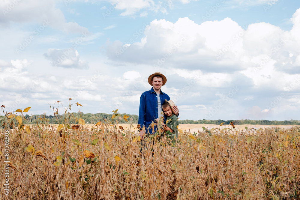 Agronomist, father and son together in agriculture field with soybeans ...