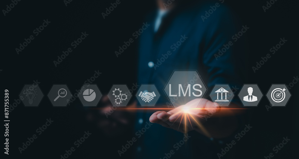 concept of a learning management system (LMS), a businessman touches a virtual screen displaying ...