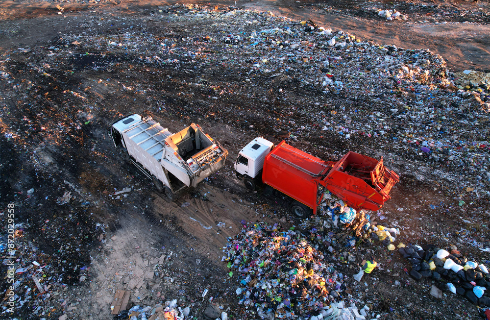 Garbage truck unloads rubbish in landfill. Landfill with waste disposal ...