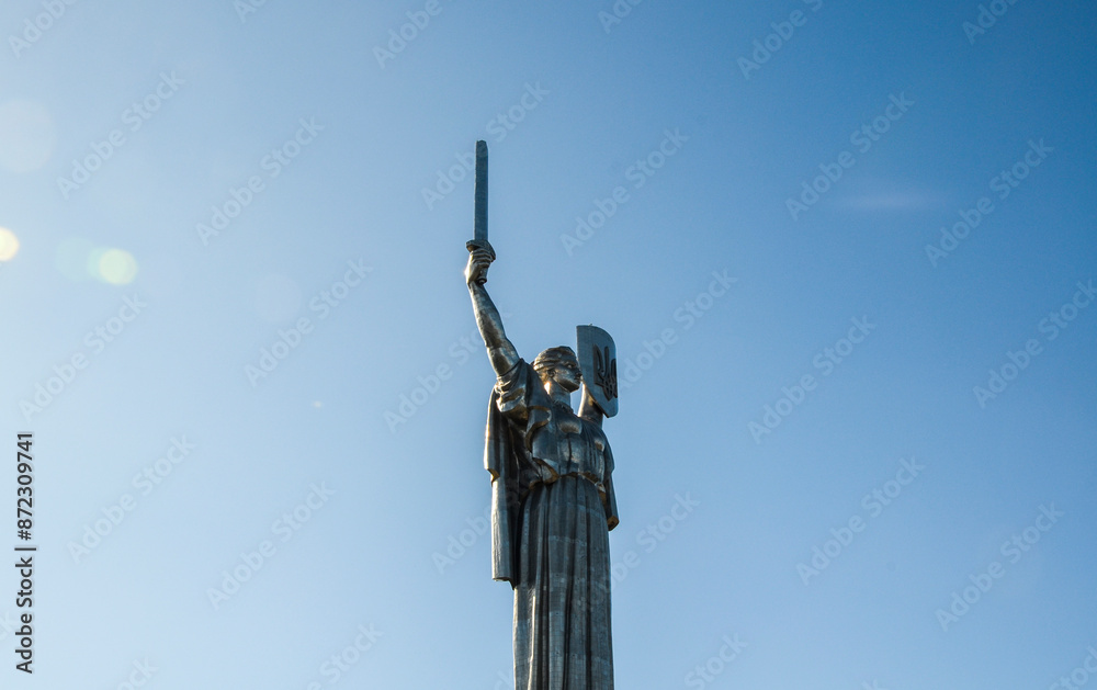 The statue of the Motherland Monument holding a sword aloft and metal ...
