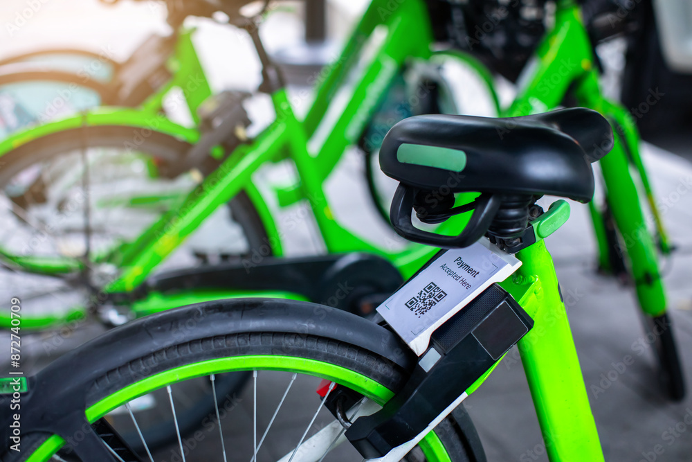 QR code Tag on bicycle. Scan the QR code to pay for the bicycle rental. Scan the QR code to ...