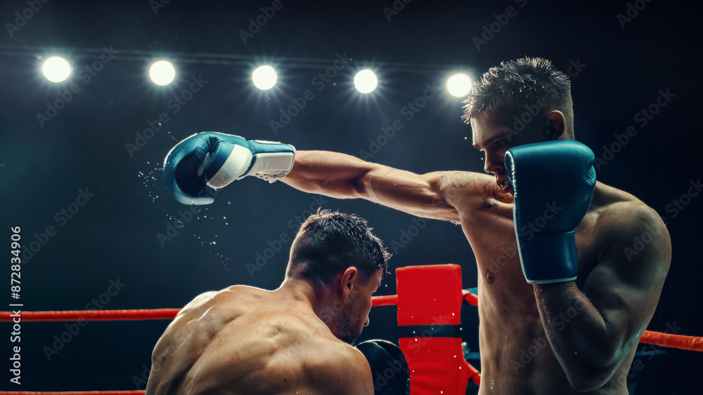 Two Male Boxers in an Electrifying Match, One Delivering Powerful Punch ...