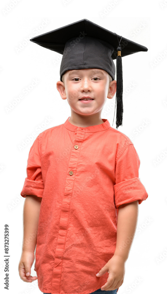 Dark haired little child wearing graduation cap with a happy face ...