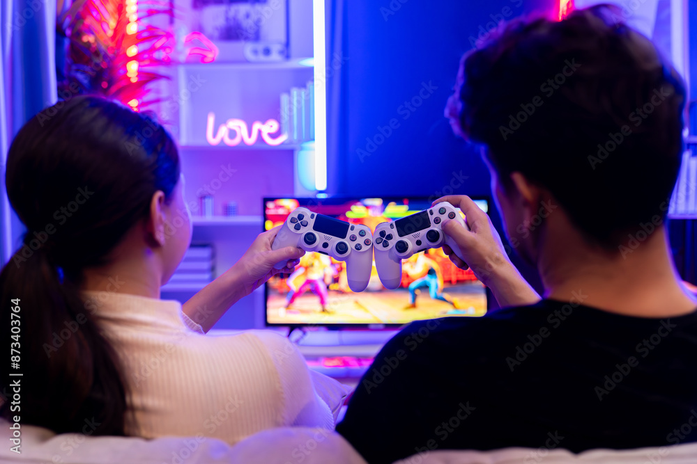 Couple or friend buddy joyful player video game on TV using joysticks ...