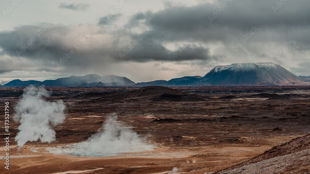 Námafjall Geothermal Area. Tourists in the distance, steaming fumaroles ...