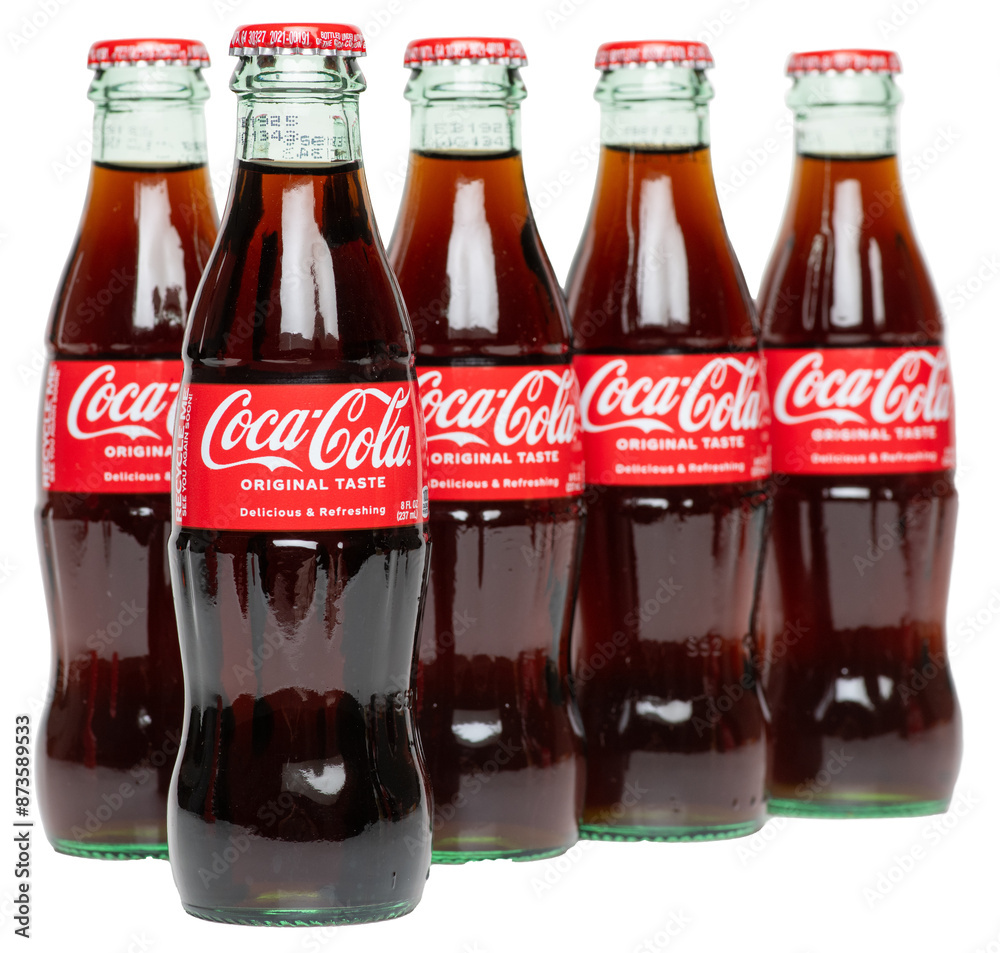 Five Bottles of Coca Cola Original taste, bottled in USA, isolated on a ...