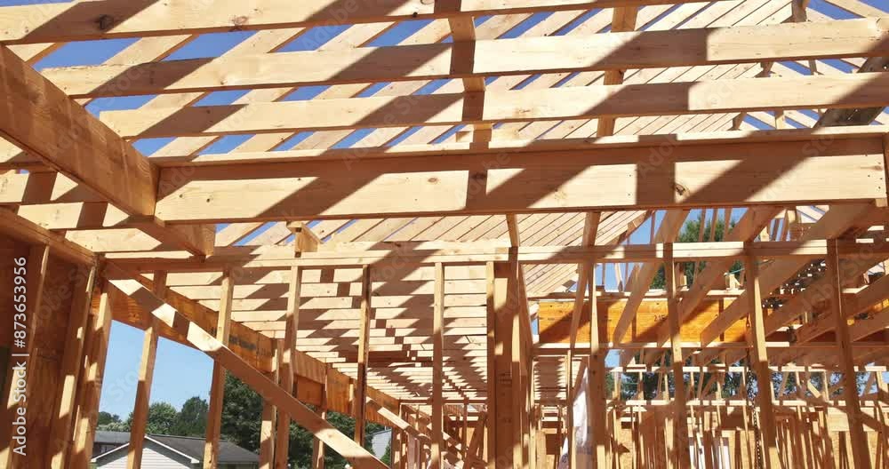 Wooden roof beams are constructed from frameworks of trusses with ...