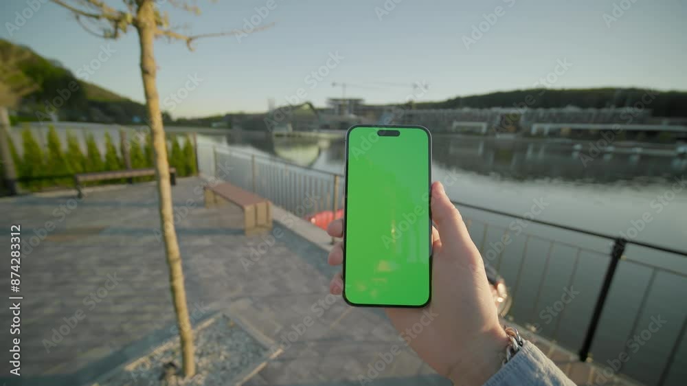 Close up young hands holding vertically phone smartphone device with ...