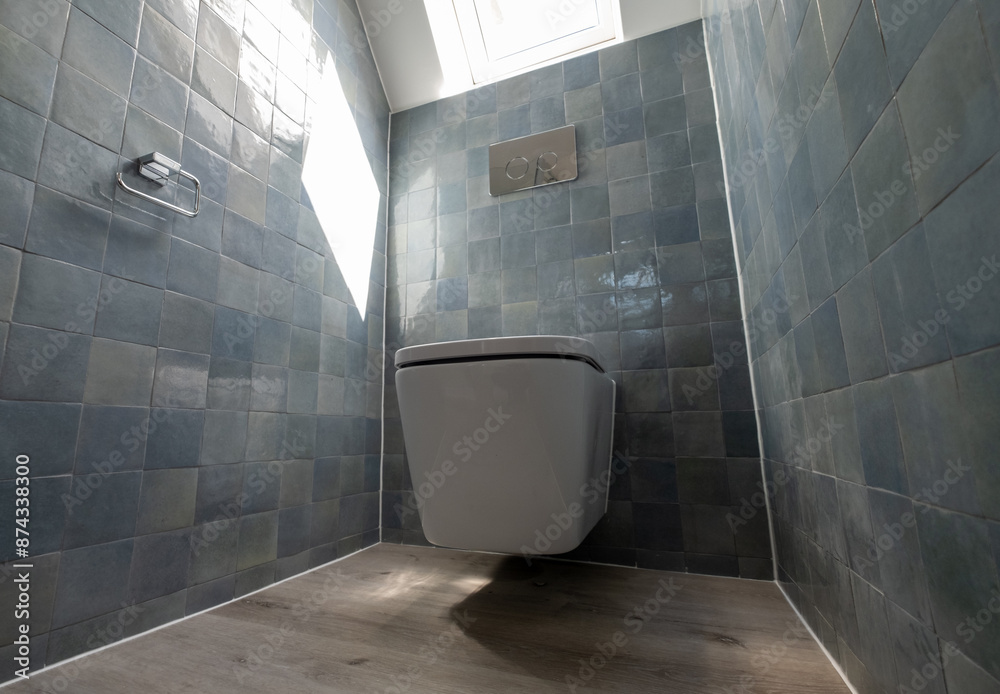 Small toilet in a loft conversion which makes clever use of eaves space ...