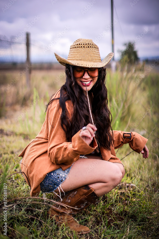 Mexican, western cowgirl with a whip in a sheriff hat. Mexican con ...