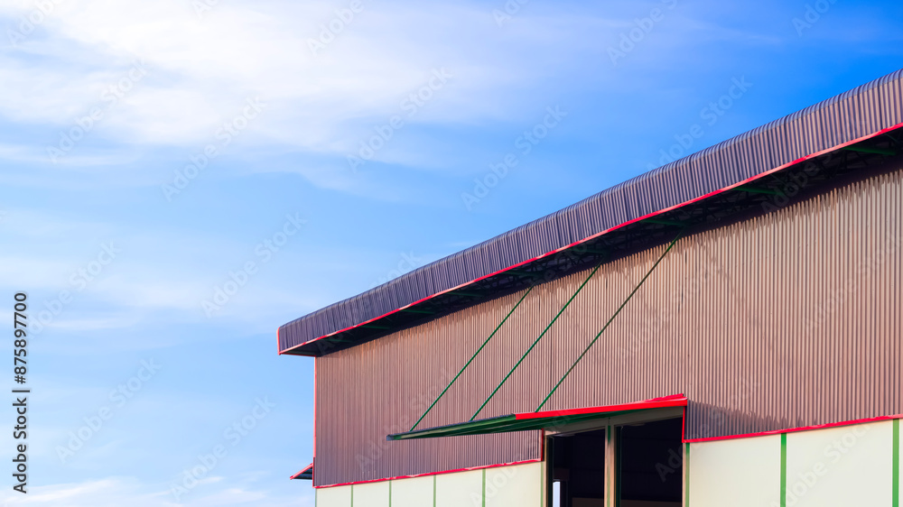 Large industrial warehouse building with entrance door and awning on ...