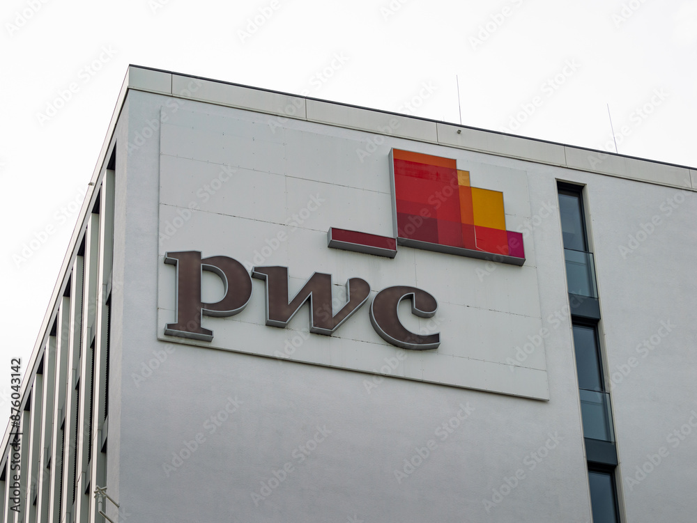 MUNICH, GERMANY - 5. July 2024: PwC logo sign on the office building ...