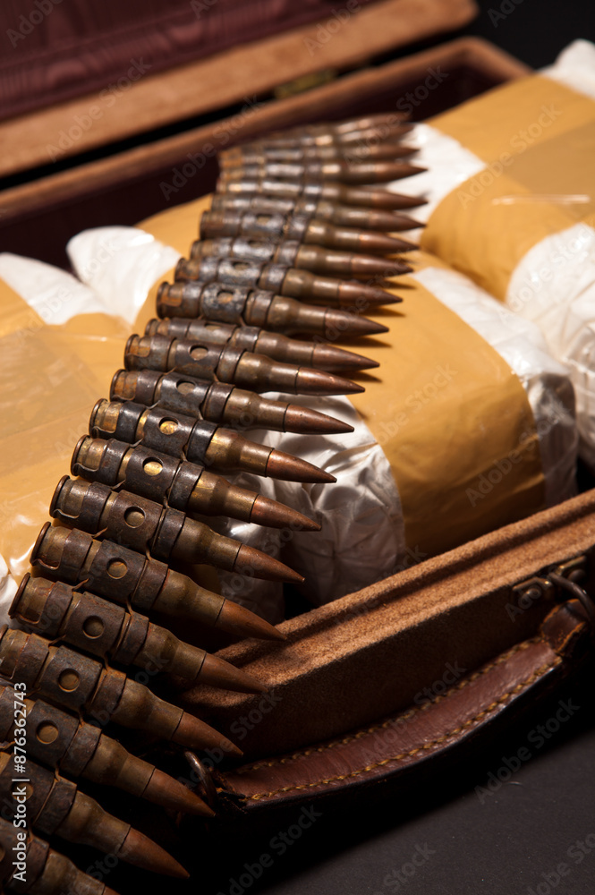 4K Ultra HD Image of a Bandolier of Bullets Draped Across Kilos of ...