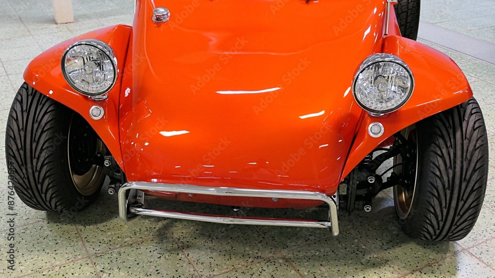 Front mask of modern light beach buggy car, orange chassis, displayed ...