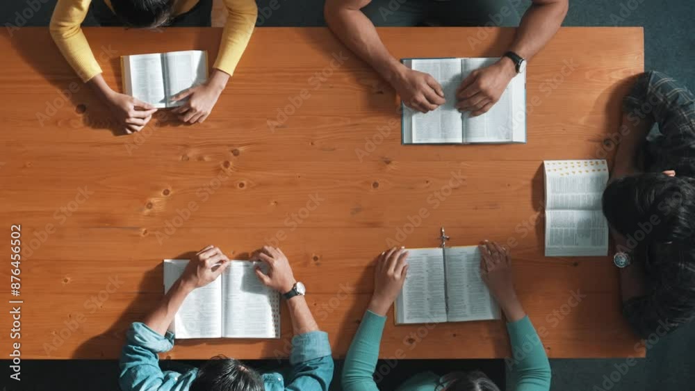 Top view of prayer hold each other support while prays to god at table ...