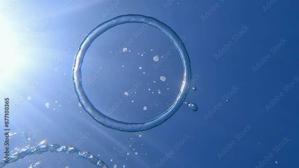 Air bubble ring under water. The freediver releases oxygen into the ...
