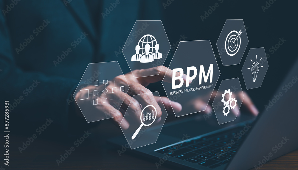 BPM, Business Process Management Concept. A businessman works on a ...