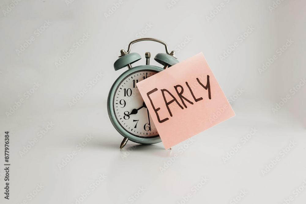 Early. Vintage Alarm Clock with "Early" Note on Pink Sticky Note ...