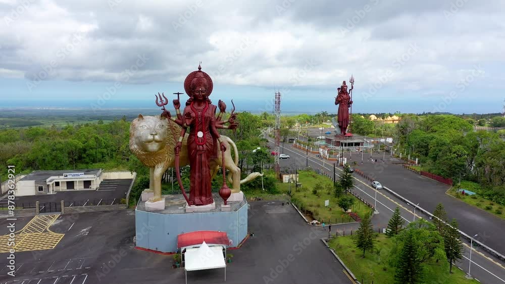 A powerful Statue of the Hindu goddess Durga Maa with a golden lion in ...