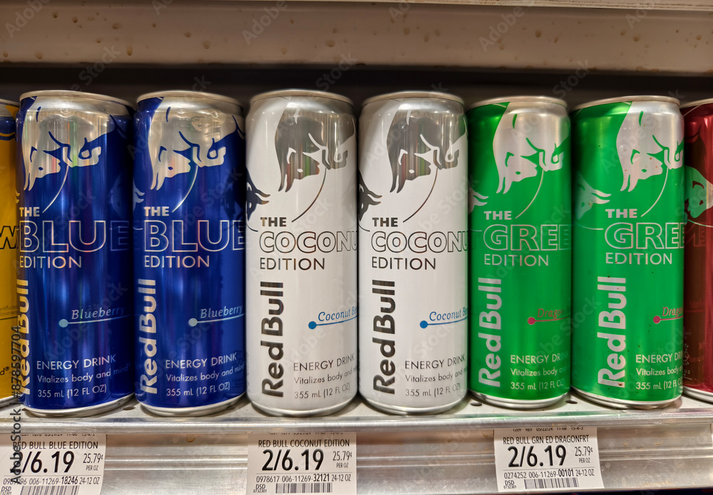 Variety of flavored Red Bull energy drinks on supermarket shelf Stock ...