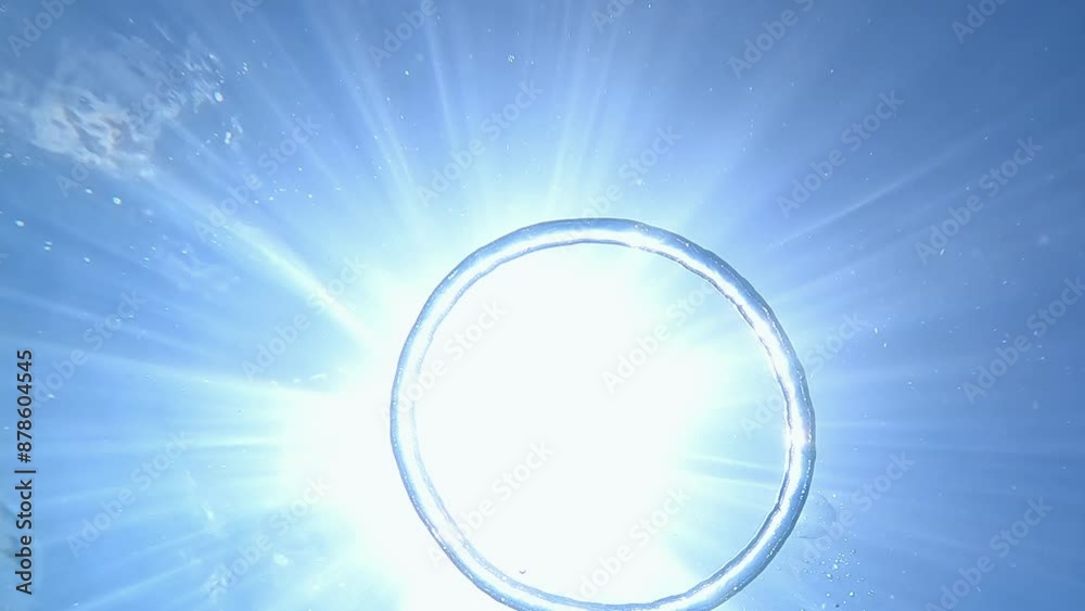 Air bubble ring under water. The freediver releases oxygen into the ...
