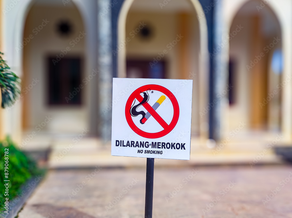 warning sign with DILARANG MEROKOK symbol in English NO SMOKING. in ...