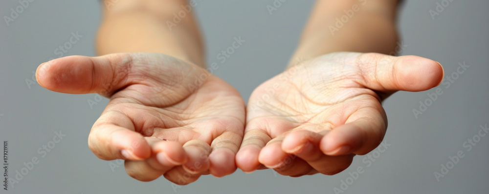 Two hands with fingers spread open, as if they are holding something ...
