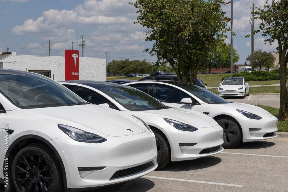 Tesla EV electric vehicles display. Tesla models include the Model 3 ...