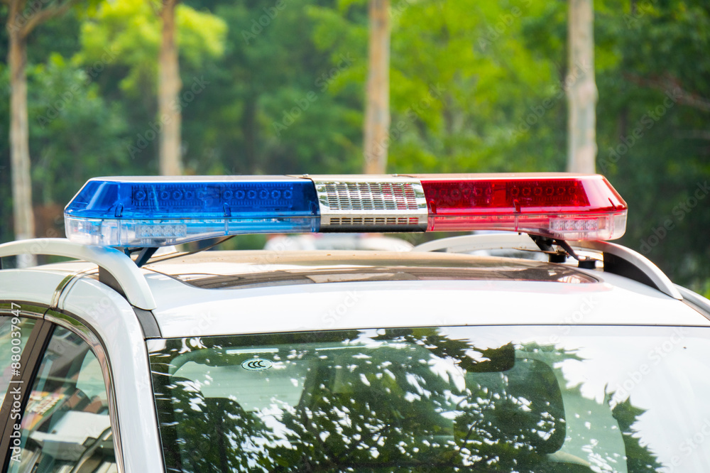 Police lights on car during traffic surveillance on the city road ...