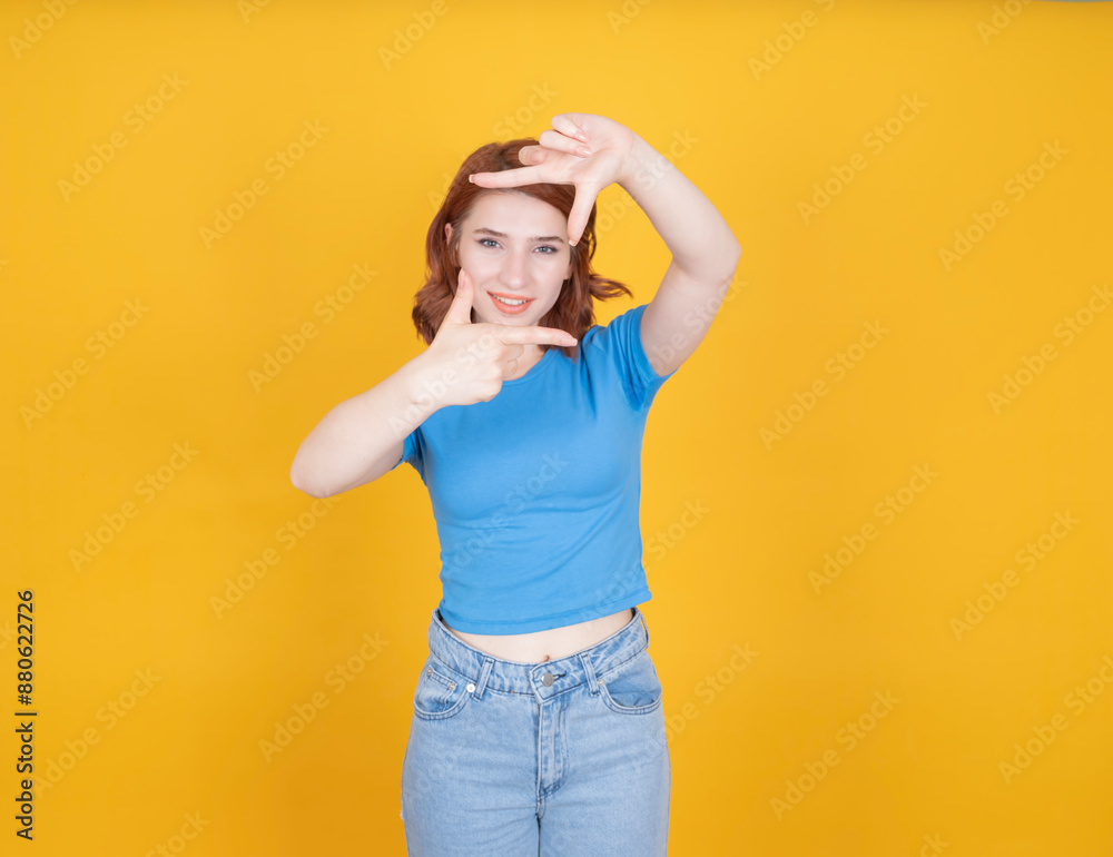 Frame with hands, young red bob hair caucasian girl standing over ...