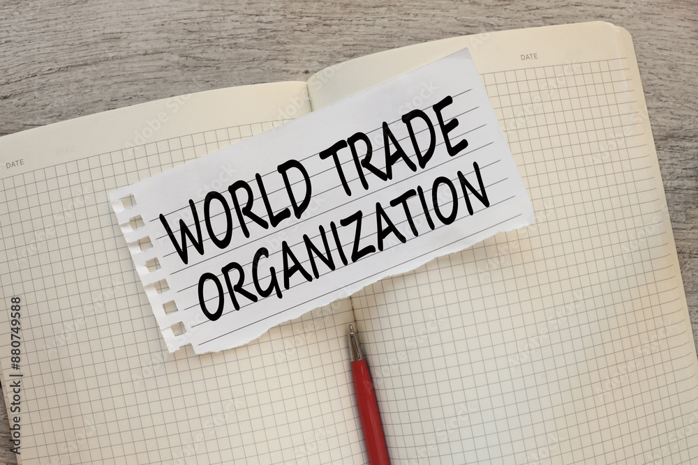 WORLD TRADE ORGANIZATION open notepad with text on torn paper Stock ...