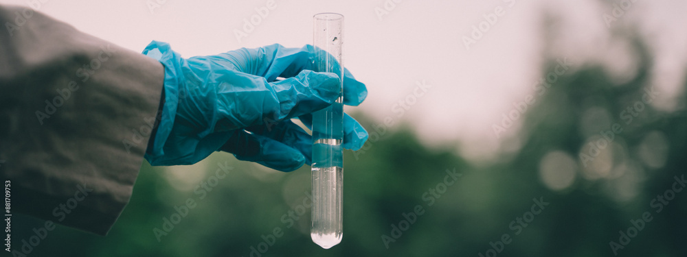 The outdoor researcher used a tube to collect water from nature ...