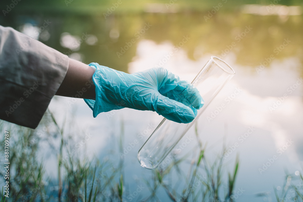 The outdoor researcher used a tube to collect water from nature ...