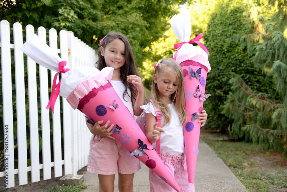 Two little preschool girls with a cornet candy for the first day of ...