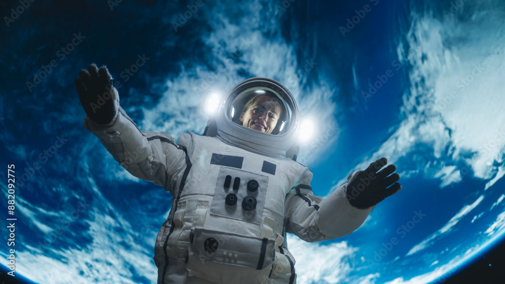 Portrait of Strong Female Astronaut Floating Outside a Spaceship with ...