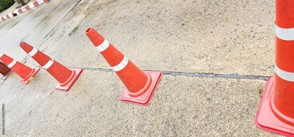 Old traffic cone placed on road while it was raining. Driver safety ...