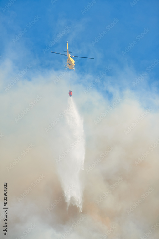 Fire, water and helicopter in sky for emergency, disaster management ...