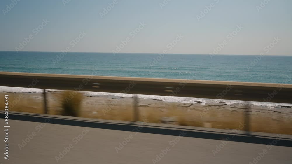 A Roadside View of the Ocean from a Moving Car. The Blue Water and ...