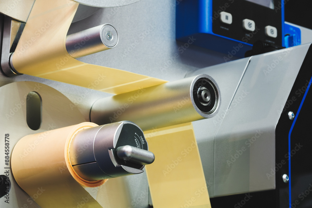 A roll of white paper is passed through the machine. printer and ...