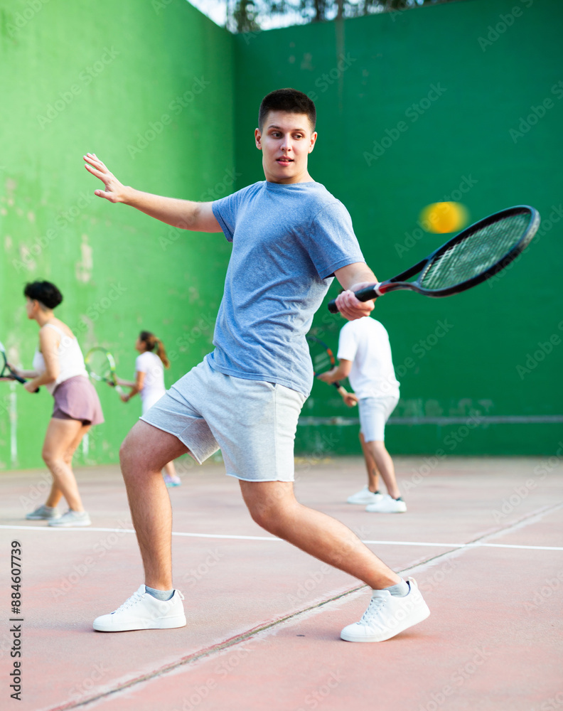 Sports active young man during friendly doubles couple match. Two men ...