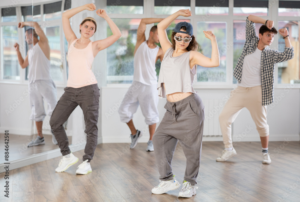 During hip hop dance lesson, girl leads, conducts classes, teaches ...